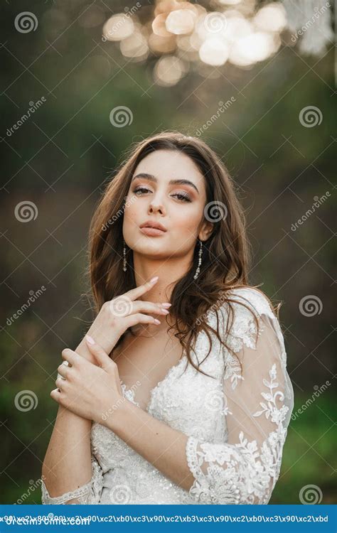A Young Cute Girl In A White Dress Poses Beautifully Positive Attitude