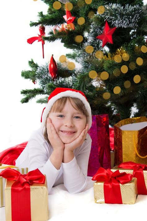 Girl In Santa Hat Lying Under Christmas Tree Stock Image Image Of