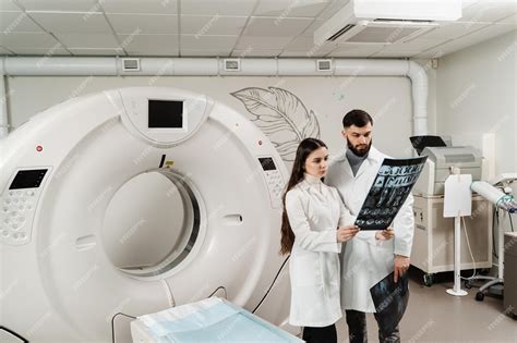 Premium Photo Two Doctors Discussing Xrays After Ct Scan Of Patient