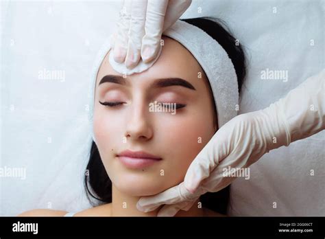 Caring For The Skin Cosmetic Cream On A Womans Face Spa Beauty