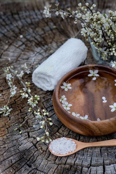 Spa And Wellness Setting With Sea Salt Oil Essence Flowers And Stock