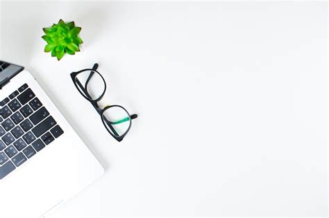 Premium Photo Workspace With Laptop Glasses And Smartphone On The
