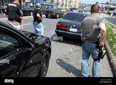 Plain Clothes Police Officers In New York City Approach A Suspect Car