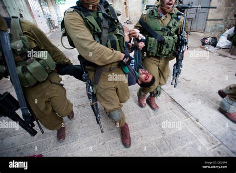Israeli Soldiers Arrest A Palestinian Youth Who Shows Signs Of Being