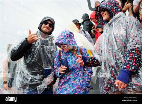 Festival Goers During Rain At Glastonbury Music Festival England