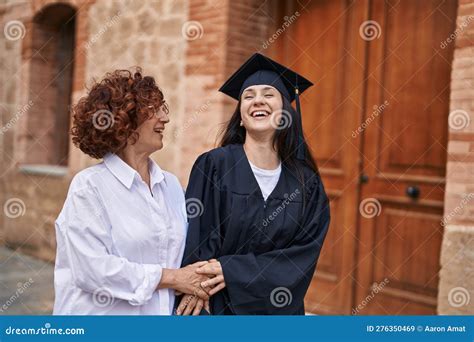 Two Women Mother And Daughter Celebrating Graduation At Campus