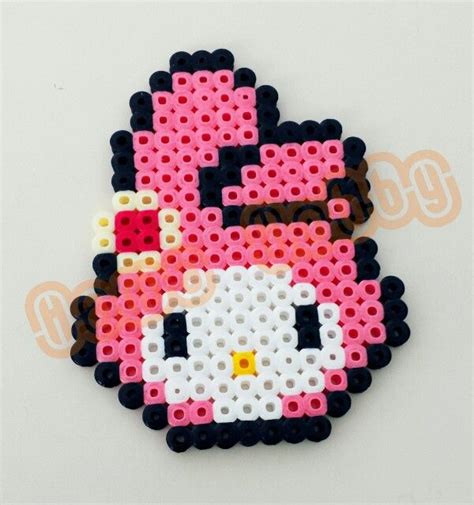 An Image Of A Hello Kitty Hamster Made Out Of Perler Beads On A White