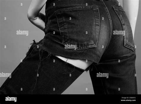 Beautiful Slim Female Back In Ripped Jeans Close Up Monochrome Stock