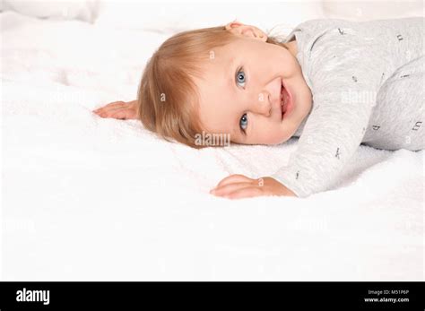 Portrait Of A Sweet Girl Lying On The Bed At Home Close Up Portrait