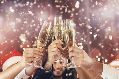 Premium Photo Cheers New Year Celebration People Holding Glasses Of