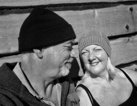 Premium Photo Close Up Of Mature Couple Sitting Against Wall