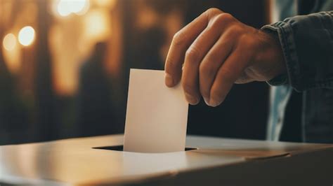 Premium Photo Closeup Of A Hand Casting A Ballot Into A Voting Box