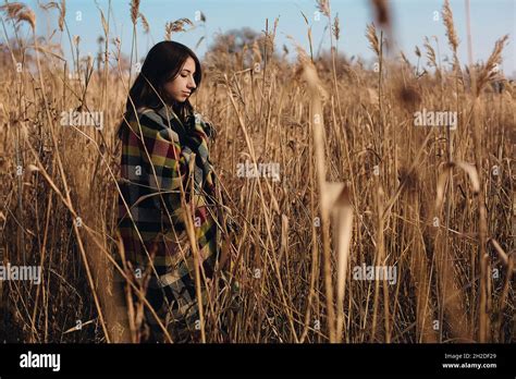 Brunette Girl Walk In Pampas Grass Field Covered In Checkered Wool