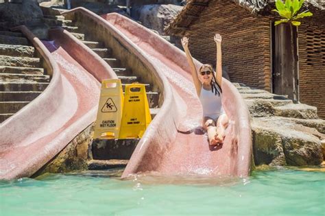 Premium Photo Woman On A Stone Water Slide In A Water Park Aqua Park
