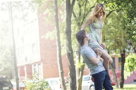 Man Holding A Woman On His Shoulder Stock Image Image Of Sunny