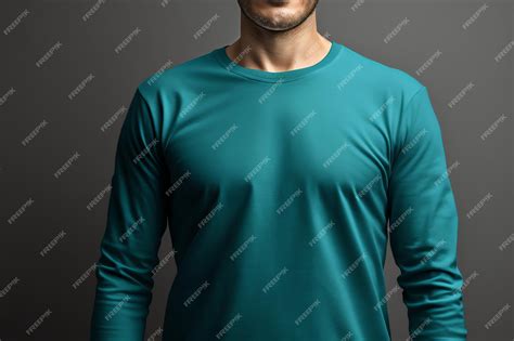 Premium Ai Image A Man In A Green Shirt Stands In Front Of A Grey