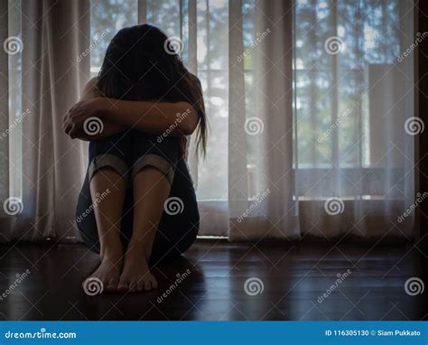 Closeup Despaired Woman Hug Her Knee And Cry While Sitting Alone Stock