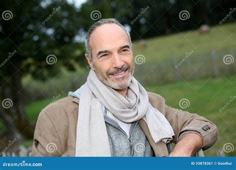 Happy Mature Man Leaning On Fence Outdoor Stock Image Image Of Smile