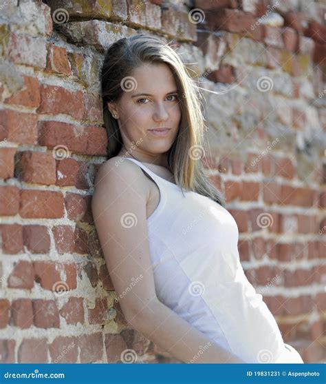 Young Woman Against A Brick Wall Stock Image Image Of Woman Sultry