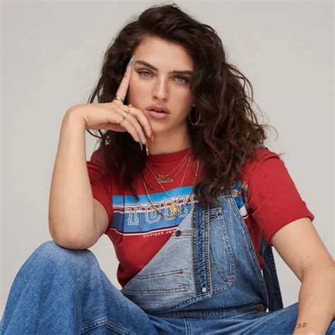 Download Mae Muller In A Stylish Outfit Posing For A Photoshoot
