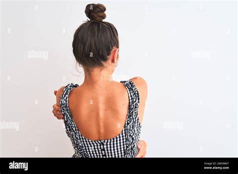Beautiful Woman With Bun Wearing Casual Dresss Standing Over Isolated