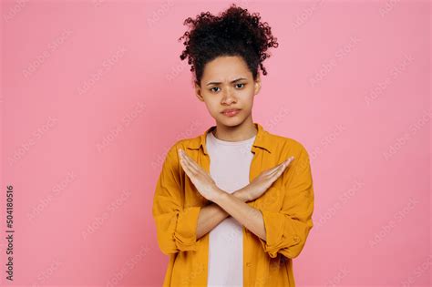 Strict Curly Haired African American Girl In Casual Clothes Saying No