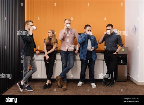 Happy Diverse Colleagues Have Fun At Lunch Break In Office Smiling