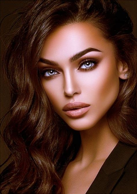 A Woman With Long Brown Hair And Blue Eyes