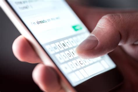 man sending text message and sms with smartphone guy texting and using