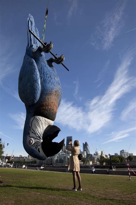 monty python s dead parrot suspended from crane in london in tribute