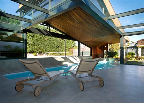 made group s origami pool house has a faceted timber ceiling