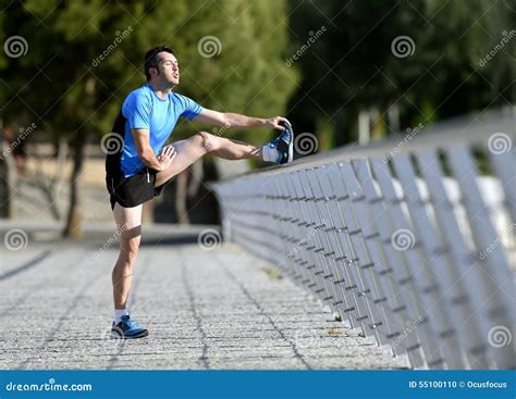 Athlete Man Stretching Legs Warming Up Calf Muscles Before Running