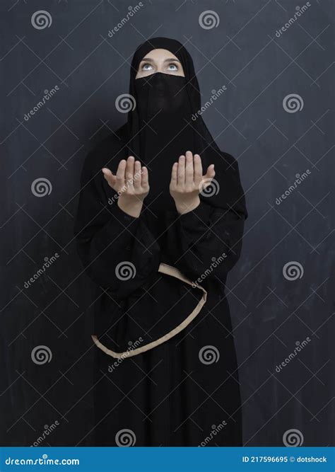 Portrait Of Young Muslim Woman With Niqab Making Dua Stock Image