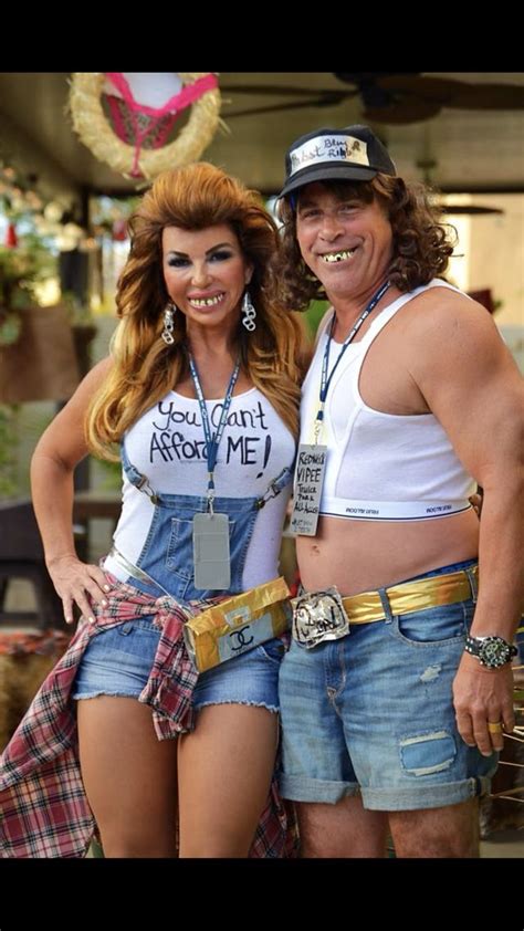 A Man And Woman Dressed Up In Costumes