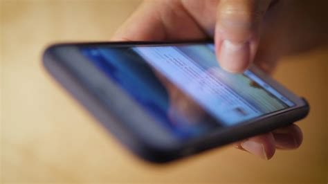an extreme closeup with shallow dof shot of someone scrolling through