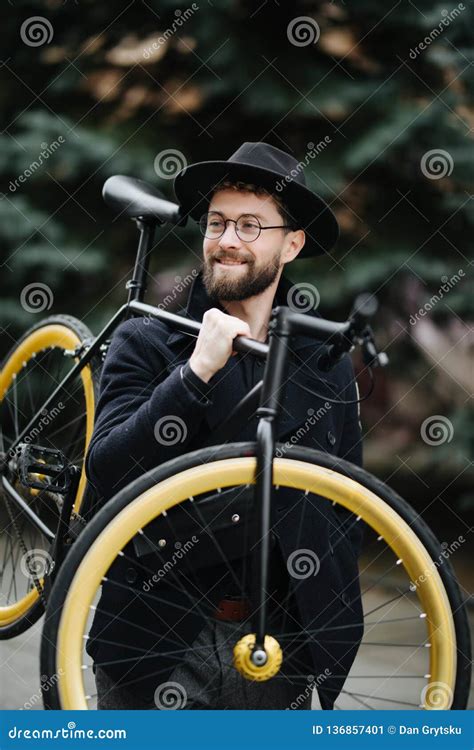 Bearded Man With A Fixie Bicycle Low Angle View Of Confident Young