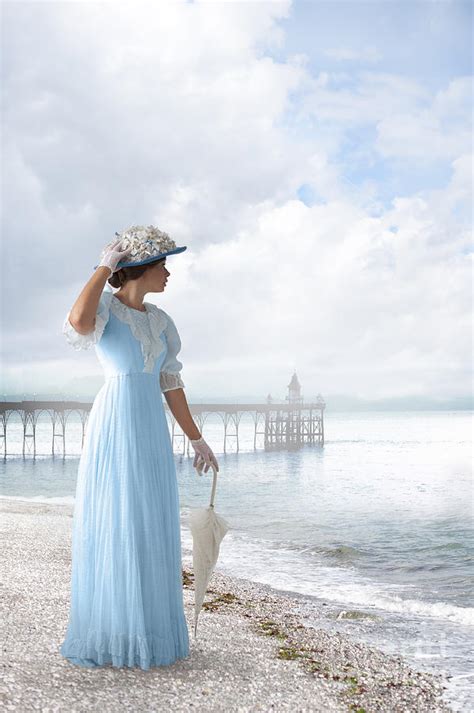 Edwardian Woman On A Beach With A Victorian Pier Photograph By Lee Avison