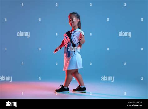 Energy Beautiful Dwarf Woman Practicing In Badminton Isolated On Blue