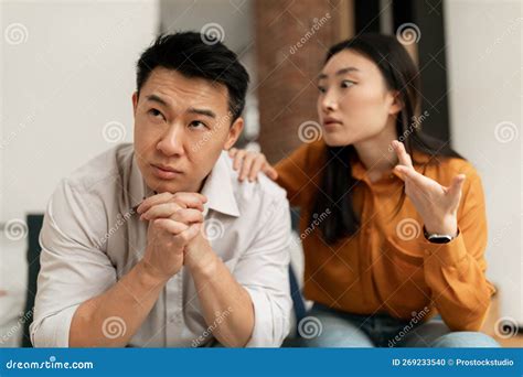 Emotional Chinese Wife Yelling And Gesturing At Middle Aged Husband