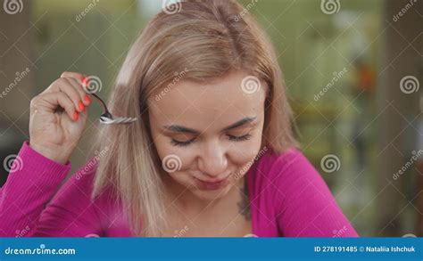 Close Up Blond Caucasian Woman With Brown Eyes Eating Tasty Dumpling