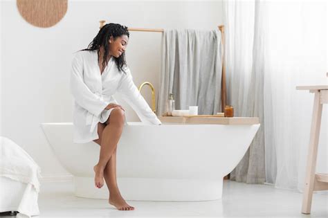 Premium Photo Smiling Attractive African American Woman Sitting On