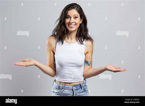 Beautiful Happy Brunette Woman Spreading Her Arms To The Side Isolated