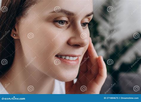 Close Up Portrait Of Happy Beautiful Girl Holding Cheek With Laugh