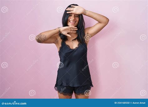 Brunette Woman Wearing Black Pajama Smiling Cheerful Playing Peek A Boo