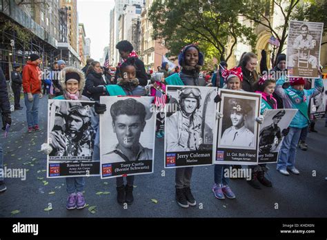 Girl Scouts Honor Wwii War Veterans March With Their Pictures Up 5th