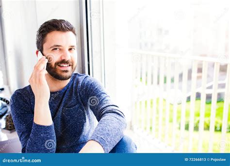 Businessman Working From Home Holding Smartphone Making Phone C Stock