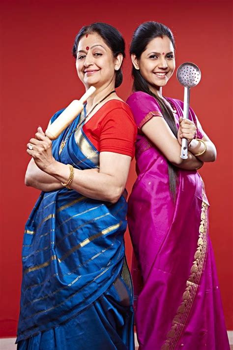 Mother And Daughter Standing Back To Back With Utensils Photoshoot