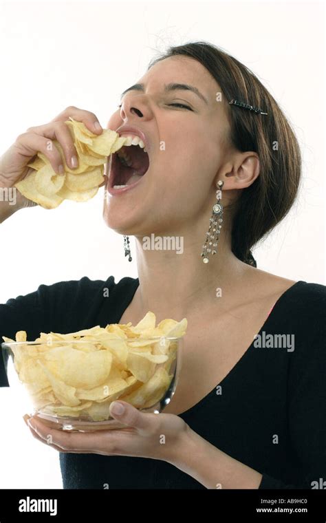 Woman Dispatching Potato Chips Having The Munchies For Potato Chips