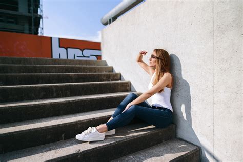 Blonde Looking Away Jeans Sneakers Stairs Shadow White Tops Long