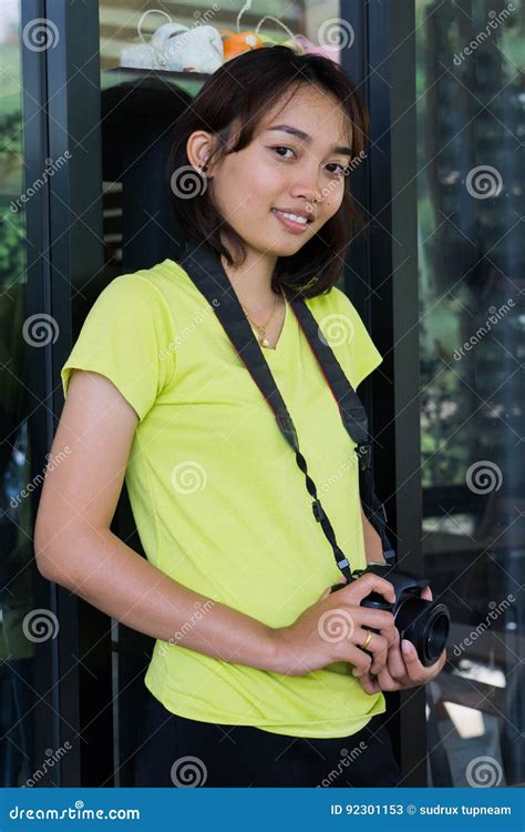 Asian Teen Is An Amateur Photographer Practicing Photography Stock